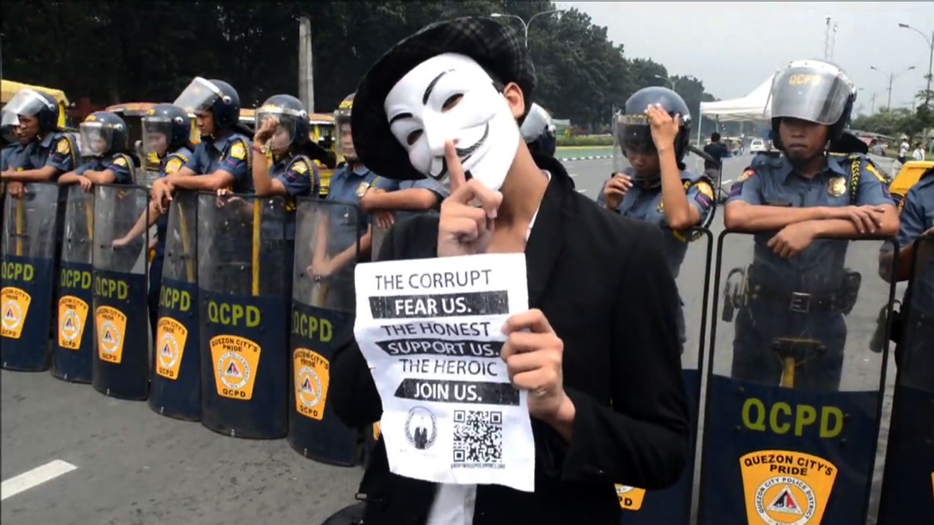 Filipino 'Anonymous' activists march against corruption - Videos - News ...