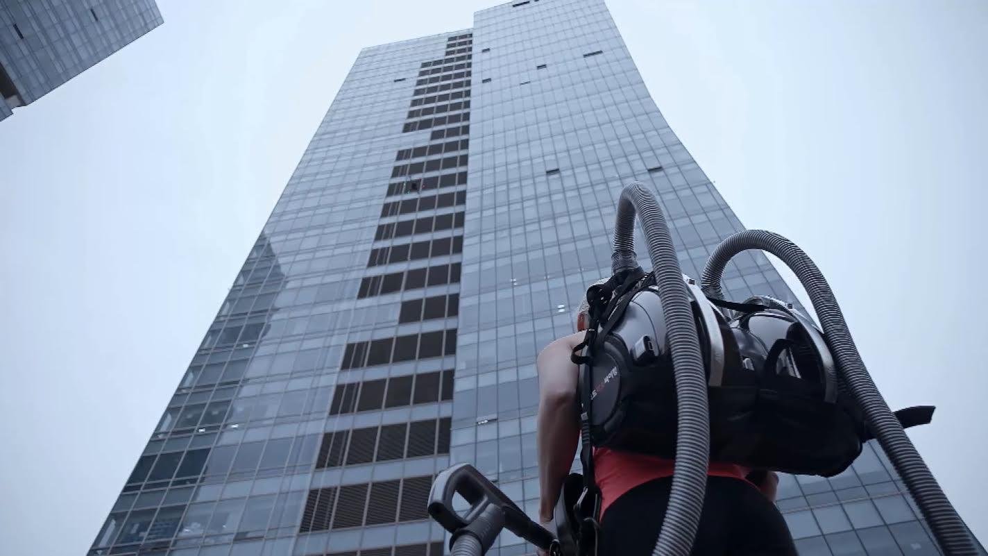 Watch 'Supermodel Spider-Woman' climb high-rise with… vacuum cleaners ...
