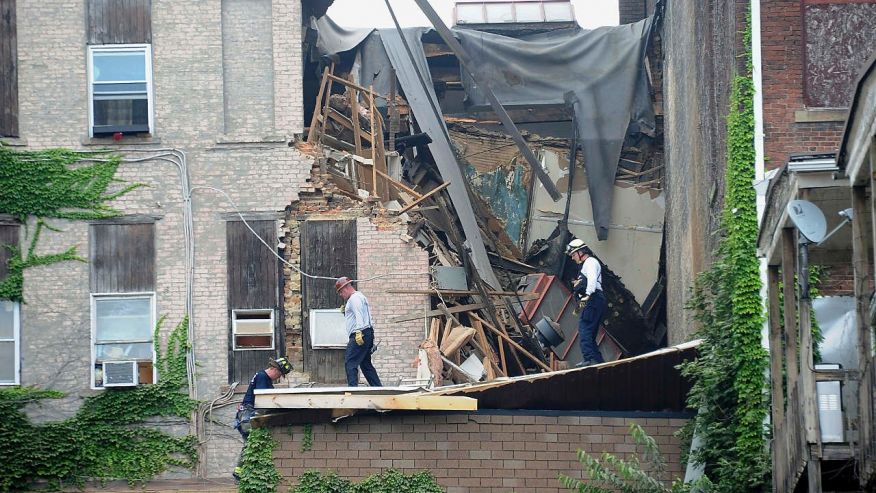 Woman trapped for 9 hours in partial building collapse is freed - News ...