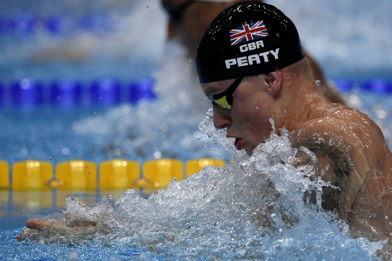 Adam Peaty breaks men's 50m breaststroke world record - Sports ...